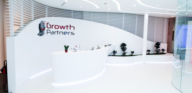 Growth Partners Solid Surface installation seamless wall/reception desk & planters - Arnold ...